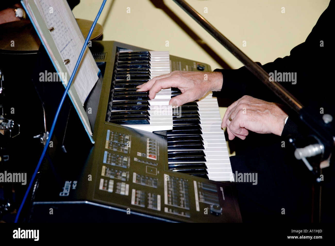 Man playing keyboards during a live performance Stock Photo - Alamy