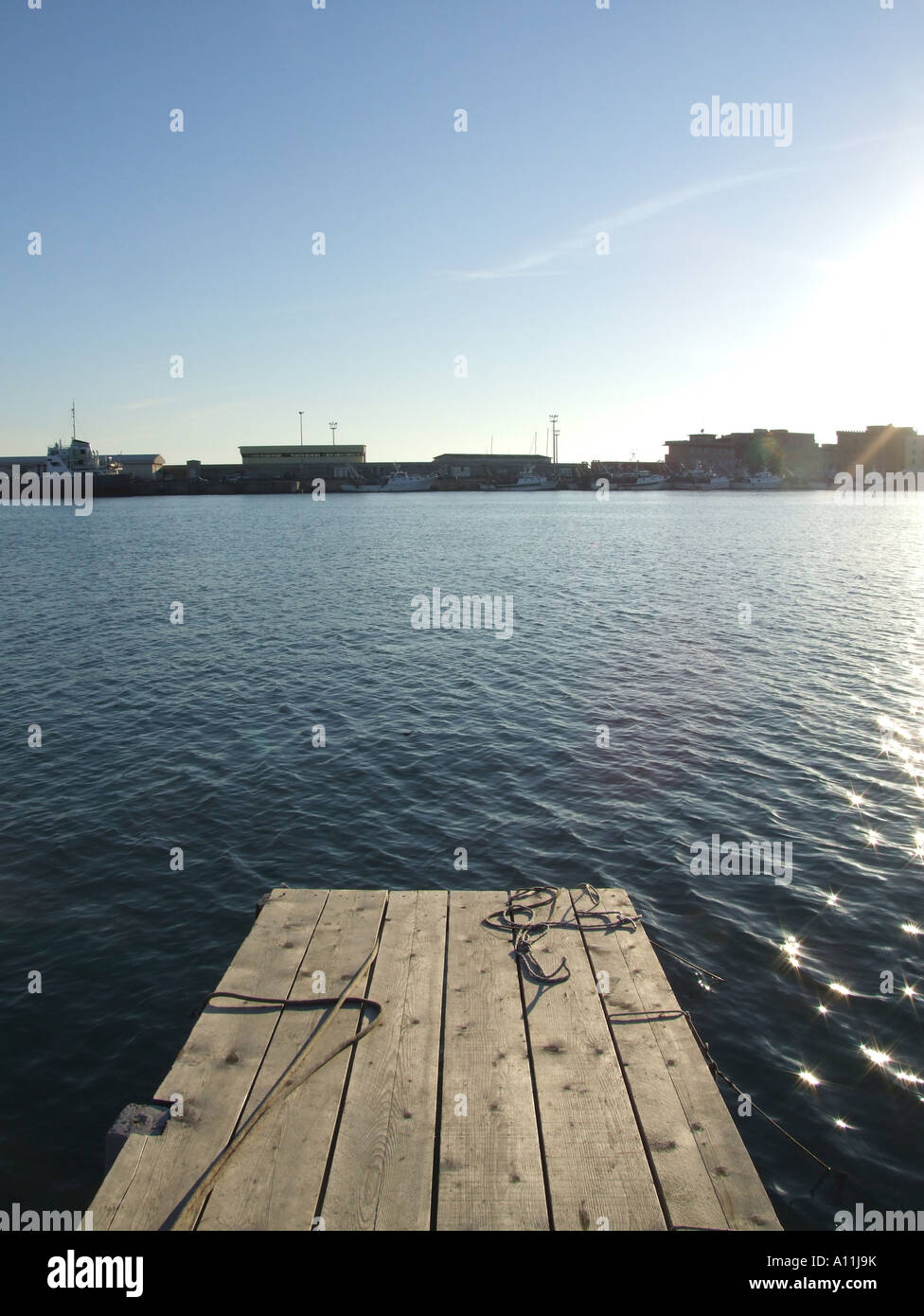 mooring ropes on small jetty by sea Stock Photo - Alamy