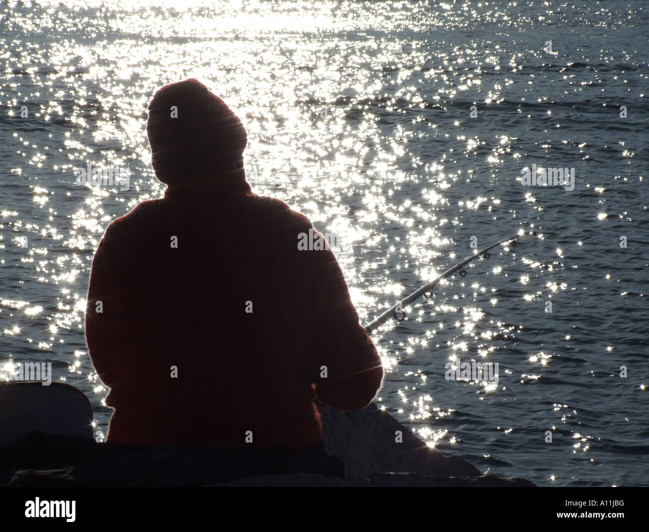 person fishing in sea Stock Photo - Alamy