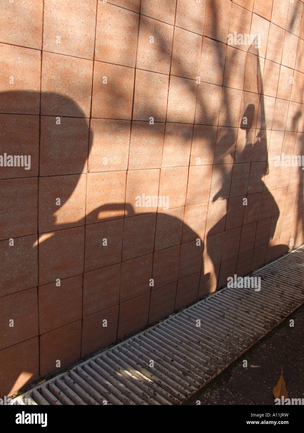 motorbike shadow on wall Stock Photo - Alamy