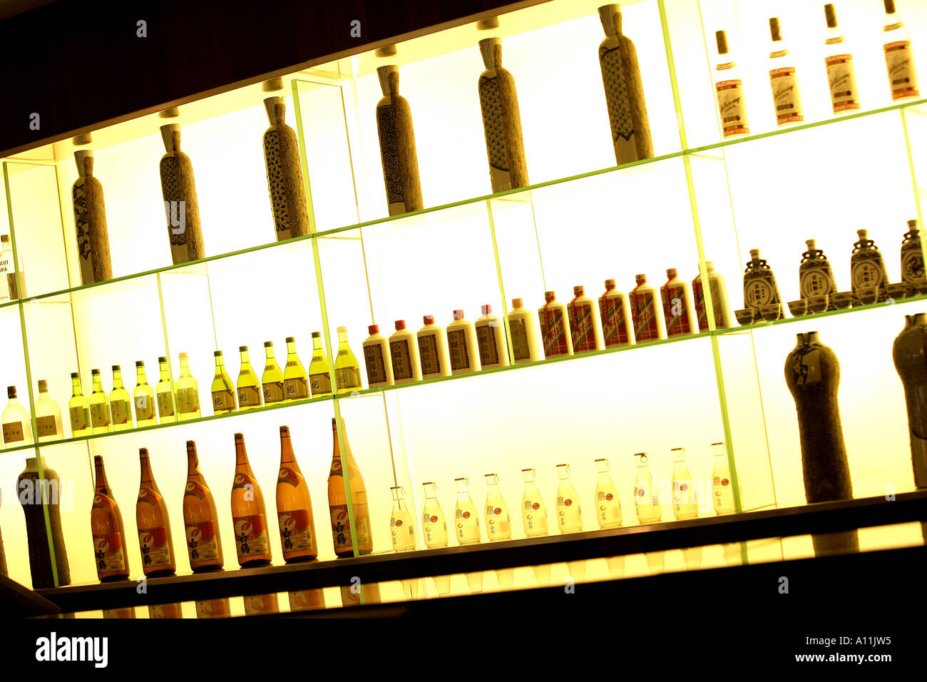 Bottles behind a bar Stock Photo - Alamy