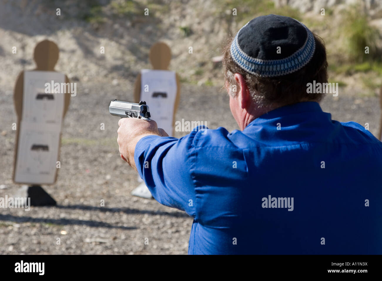 Stock Photo of a Man Shooting in an Outdoor Range Stock Photo - Alamy