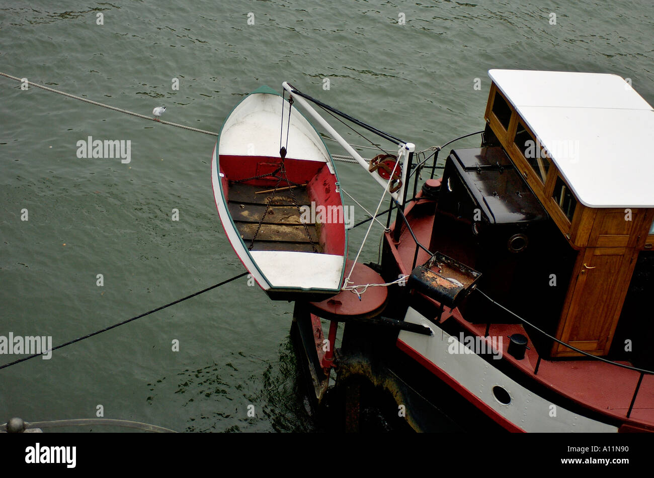 Dinghy at a stern of barge Stock Photo - Alamy