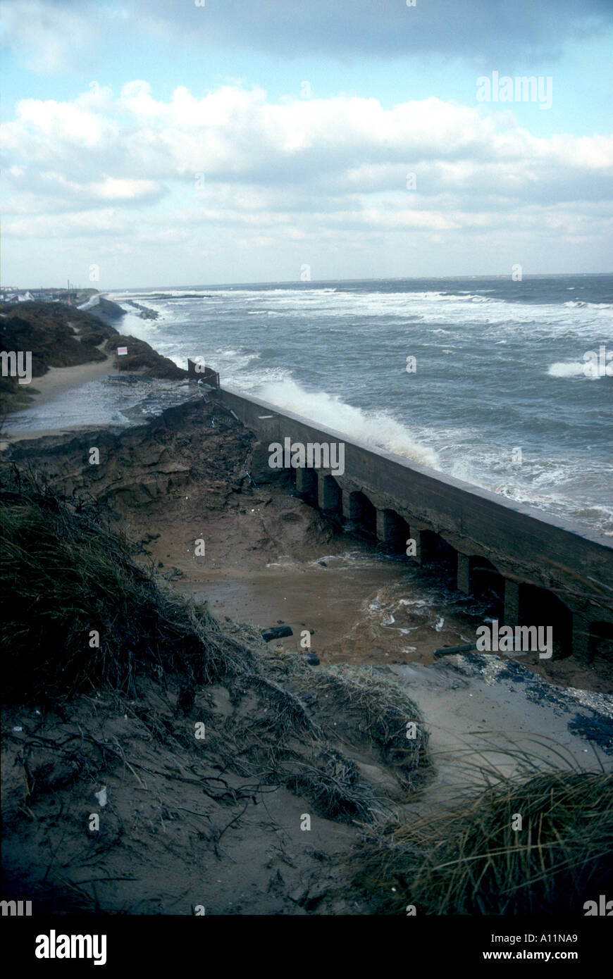 Seawall breach at Caister-On-Sea in Norfolk, England, 1997 Stock Photo ...