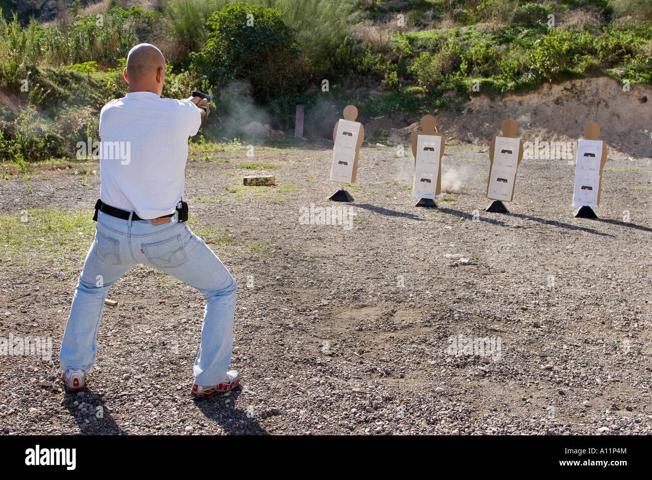 Stock Photo of a Man Shooting in an Outdoor Range Stock Photo - Alamy