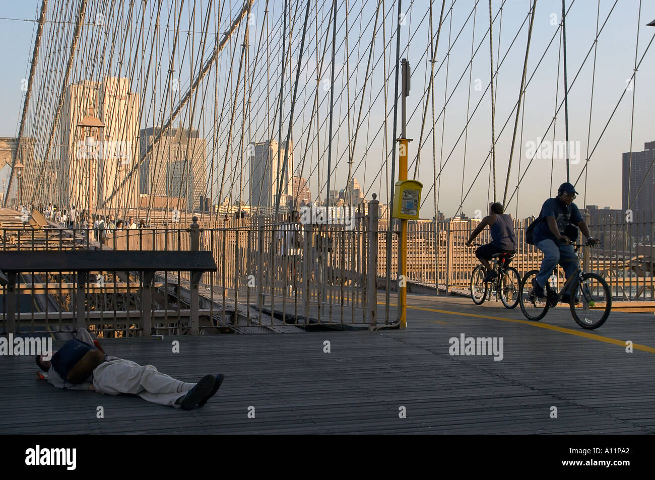young man sleeping on Brooklyn bridge after a citywide blackout work ...