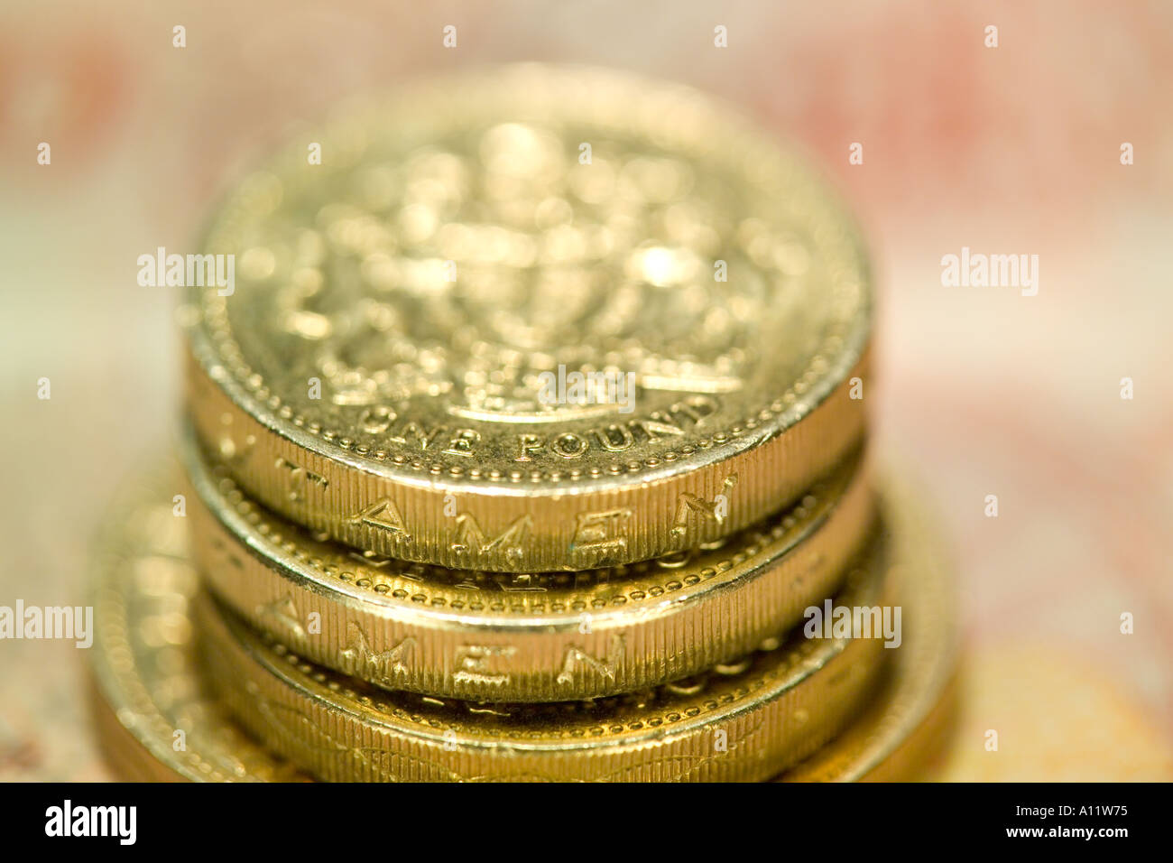 Close up Pile of 1 one British pound coins on 50 bank note Stock Photo ...