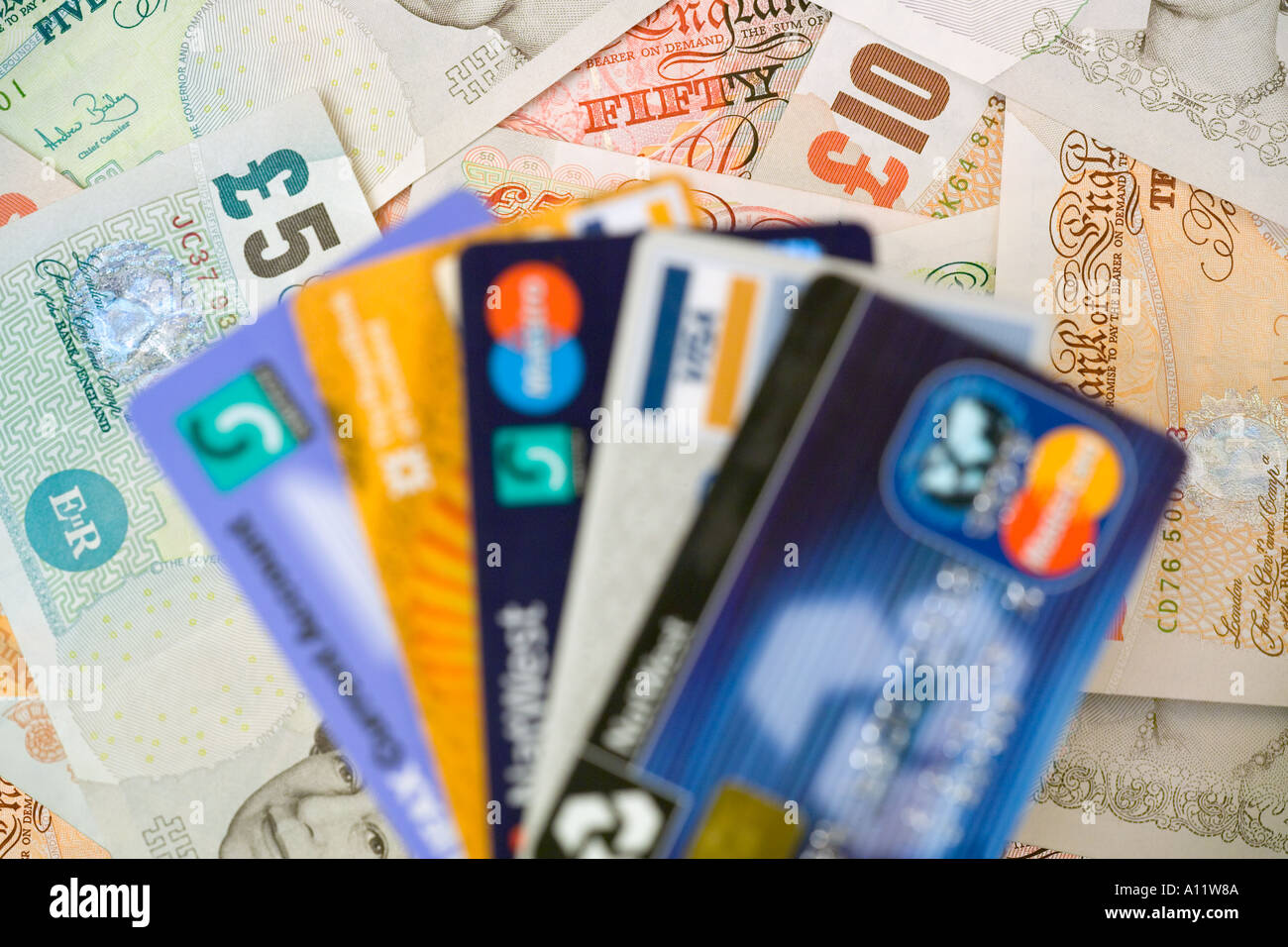 British UK credit cards over English bank notes Stock Photo - Alamy