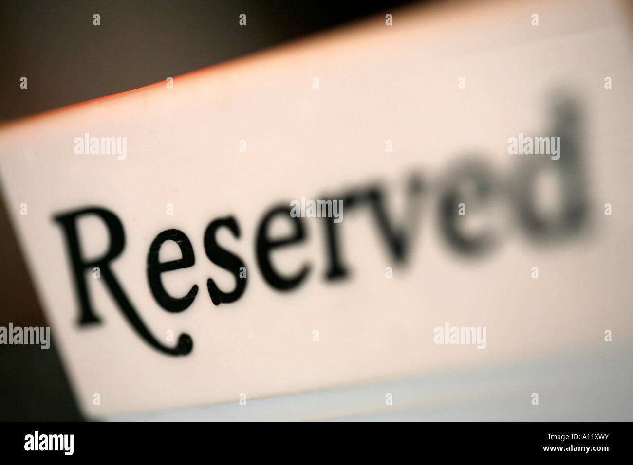 Reserved table sign in a restaurant Stock Photo - Alamy