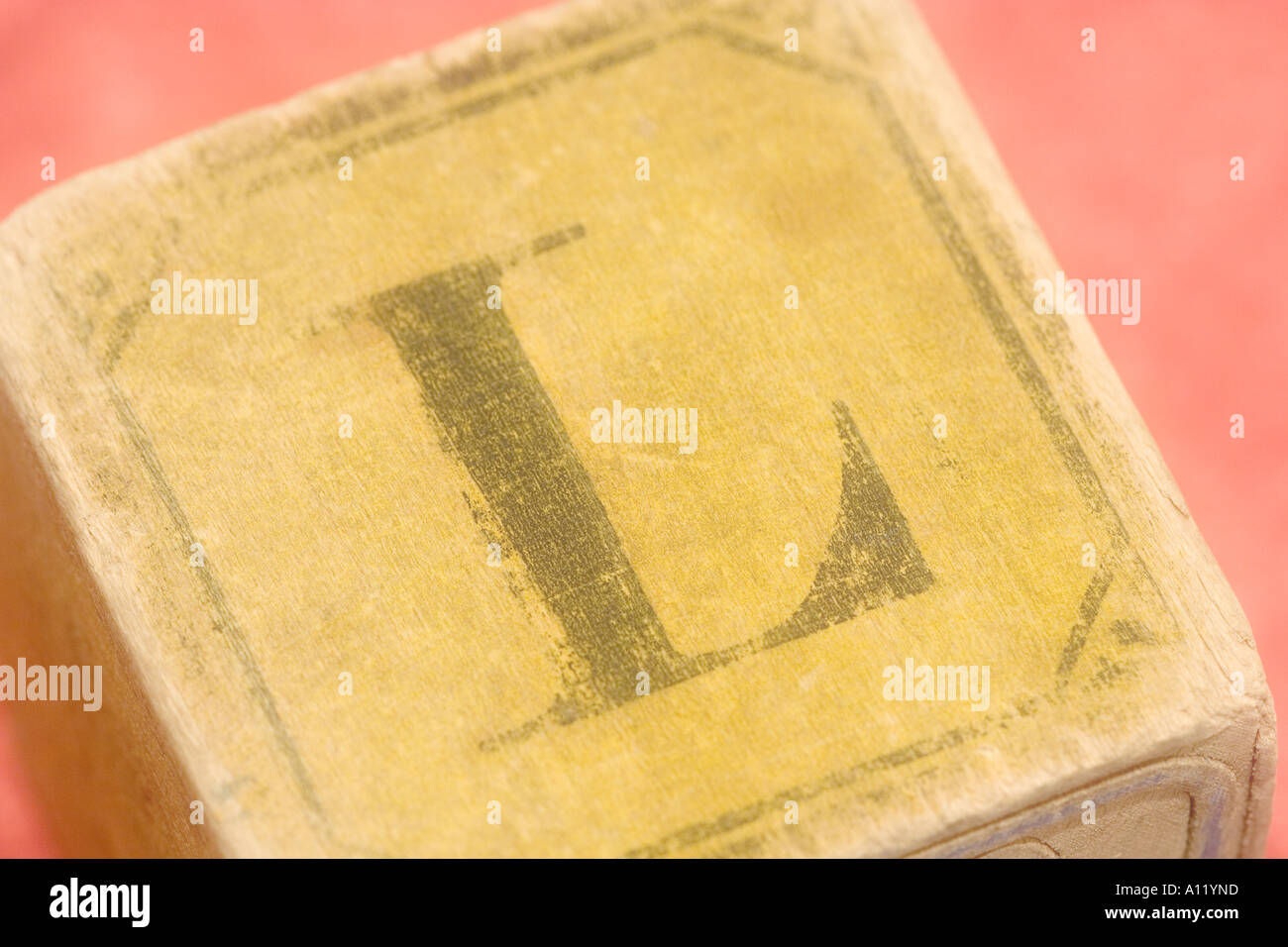 Worn and weathered children's block Stock Photo - Alamy