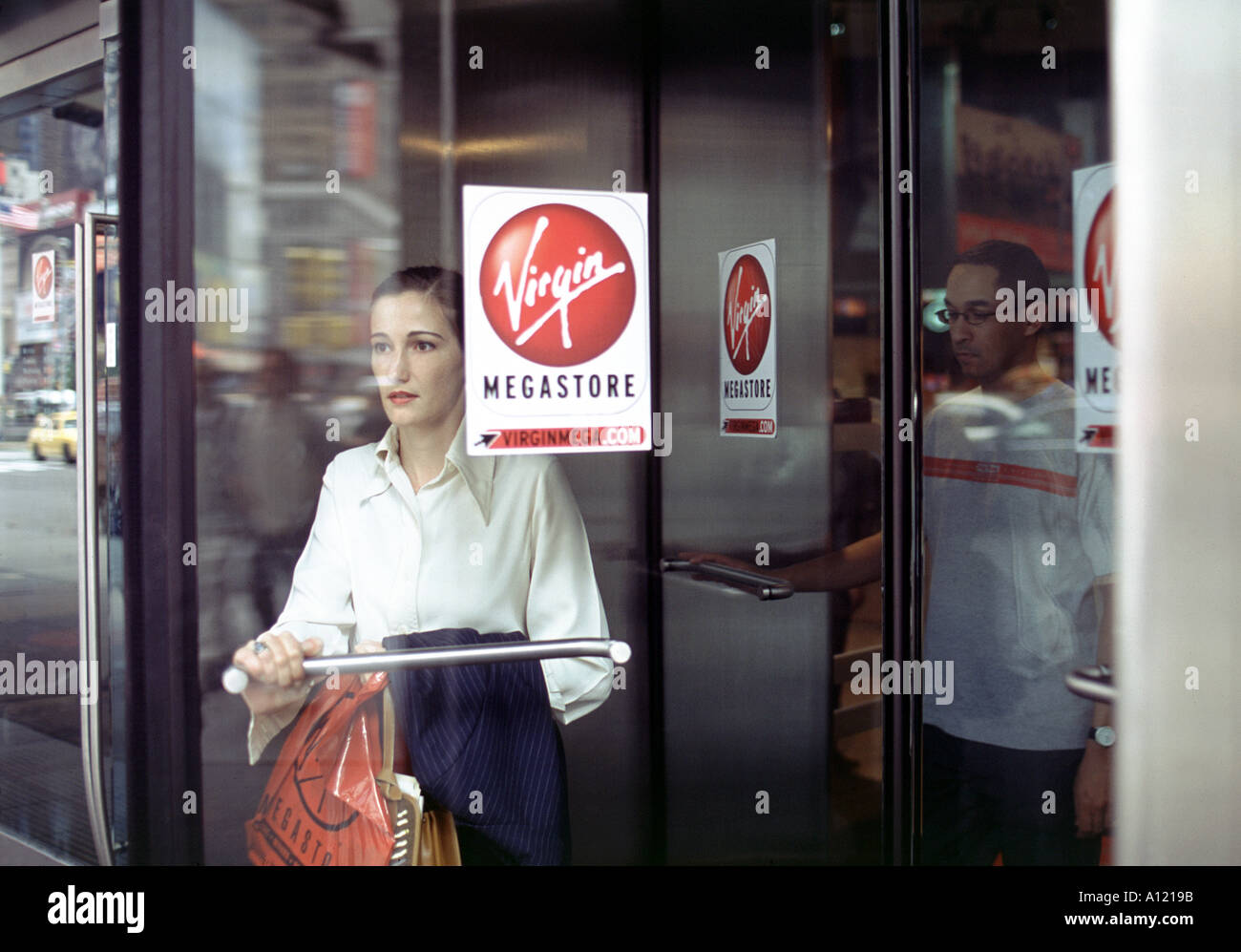 Woman exiting Virgin Music Store at Times Square New York Model ...