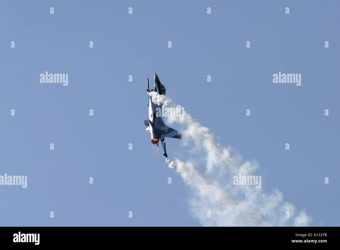 F16 military fighter jet performing an acrobatic display Stock Photo ...