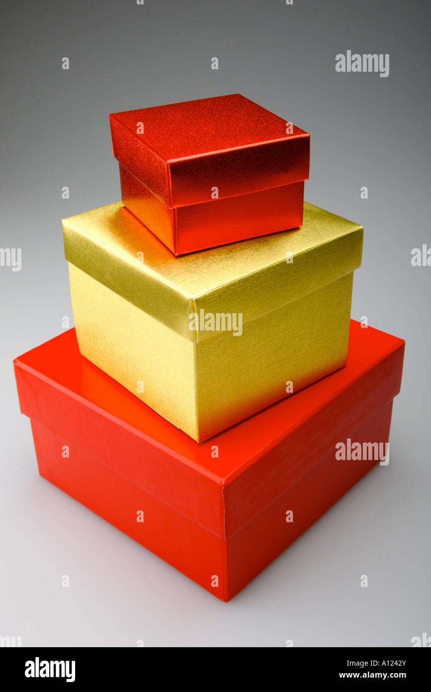 A stack of red and gold gift boxes Stock Photo - Alamy