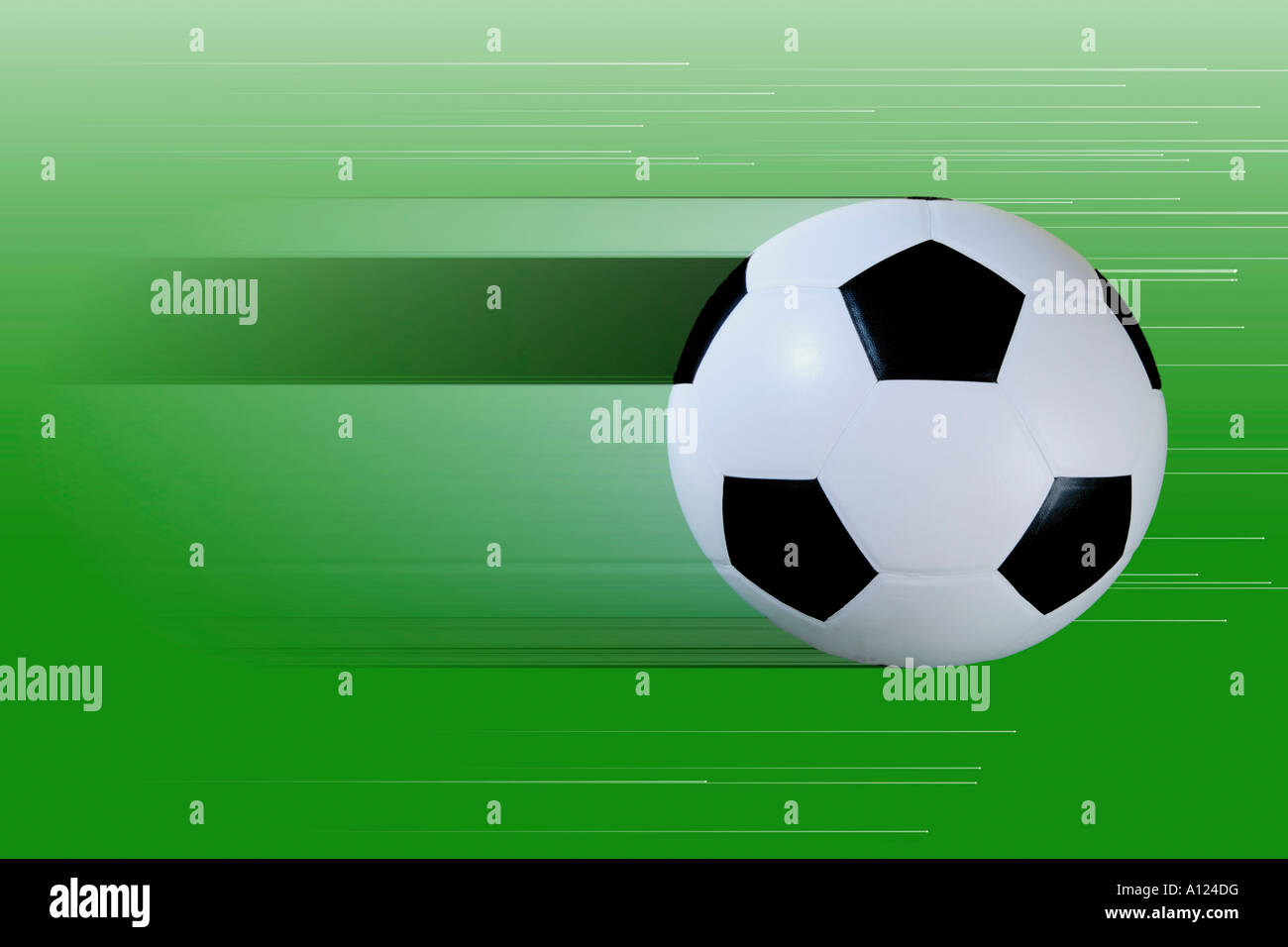 Soccer ball on a green background Stock Photo - Alamy