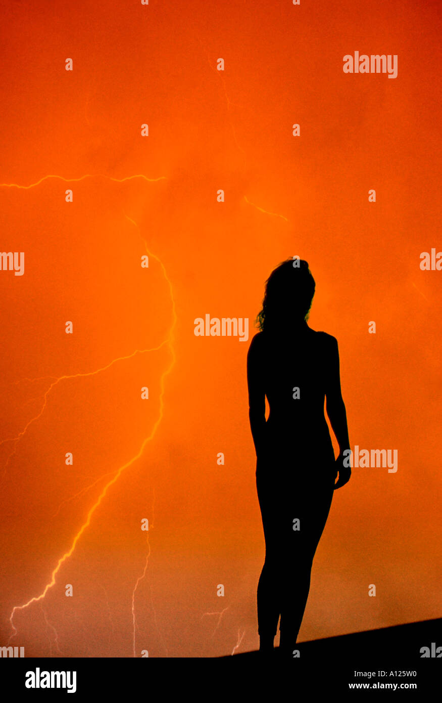 Silhouette woman lightning storm clouds hi-res stock photography and ...