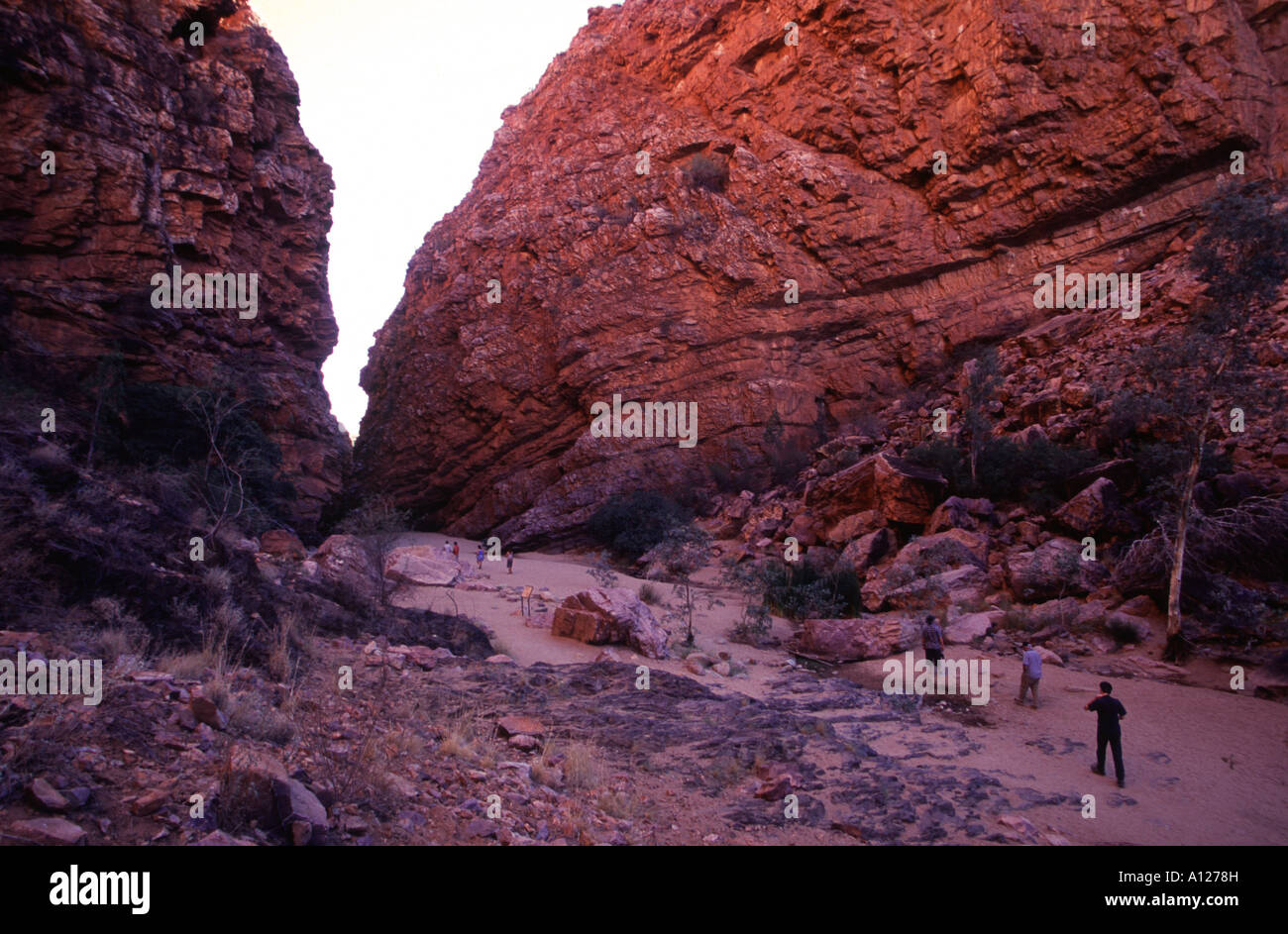 Hikers walk through Simpsons Gap, Alice Springs, Northern Territory ...
