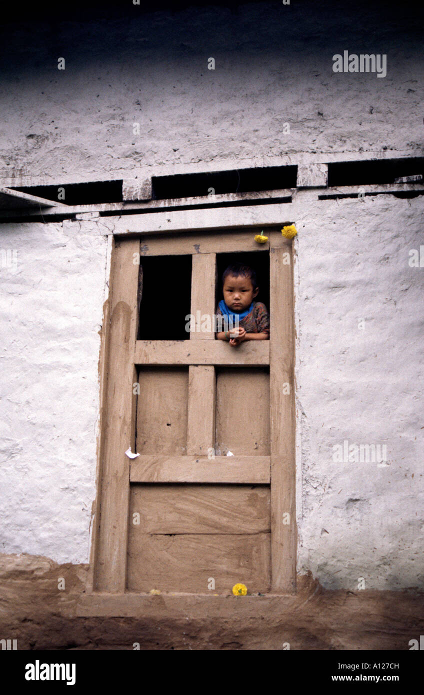 A young girl stares out from her windowless front door in the Sollu ...
