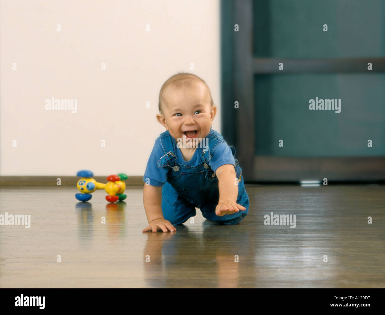 Boy crawling at home Stock Photo - Alamy