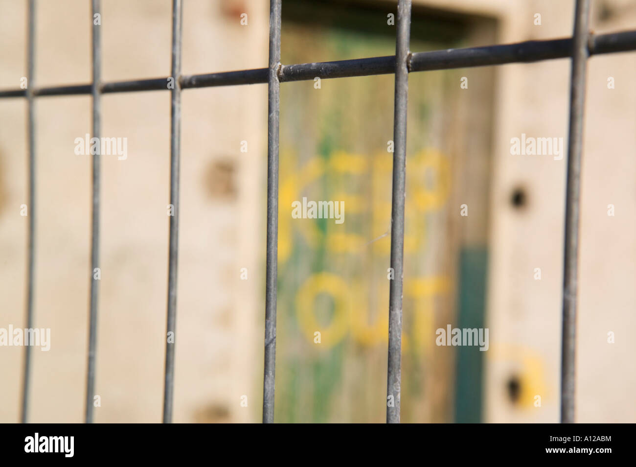 keep out sign with fence around Stock Photo - Alamy