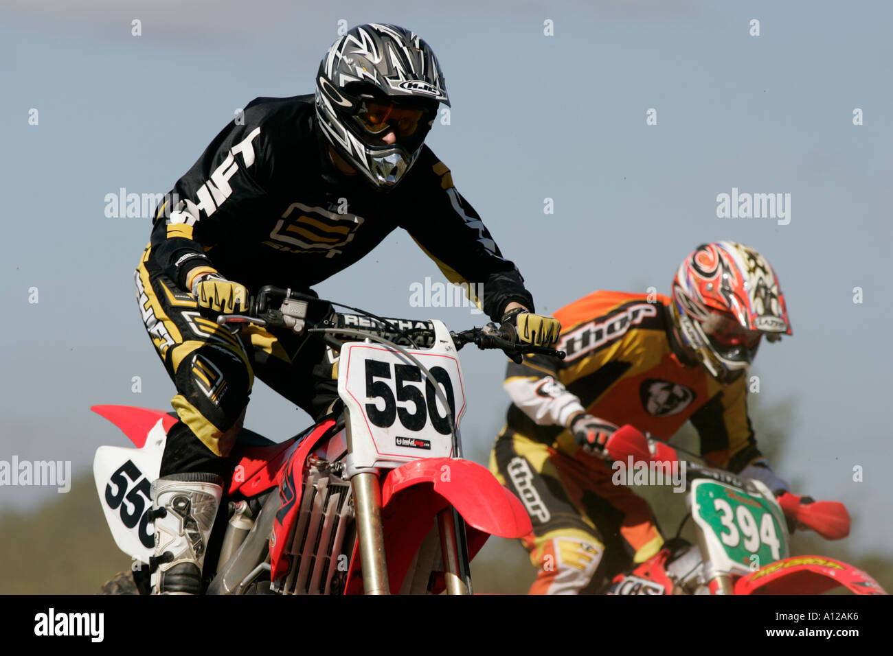 two riders jump into the air together at tandragee motocross circuit ...