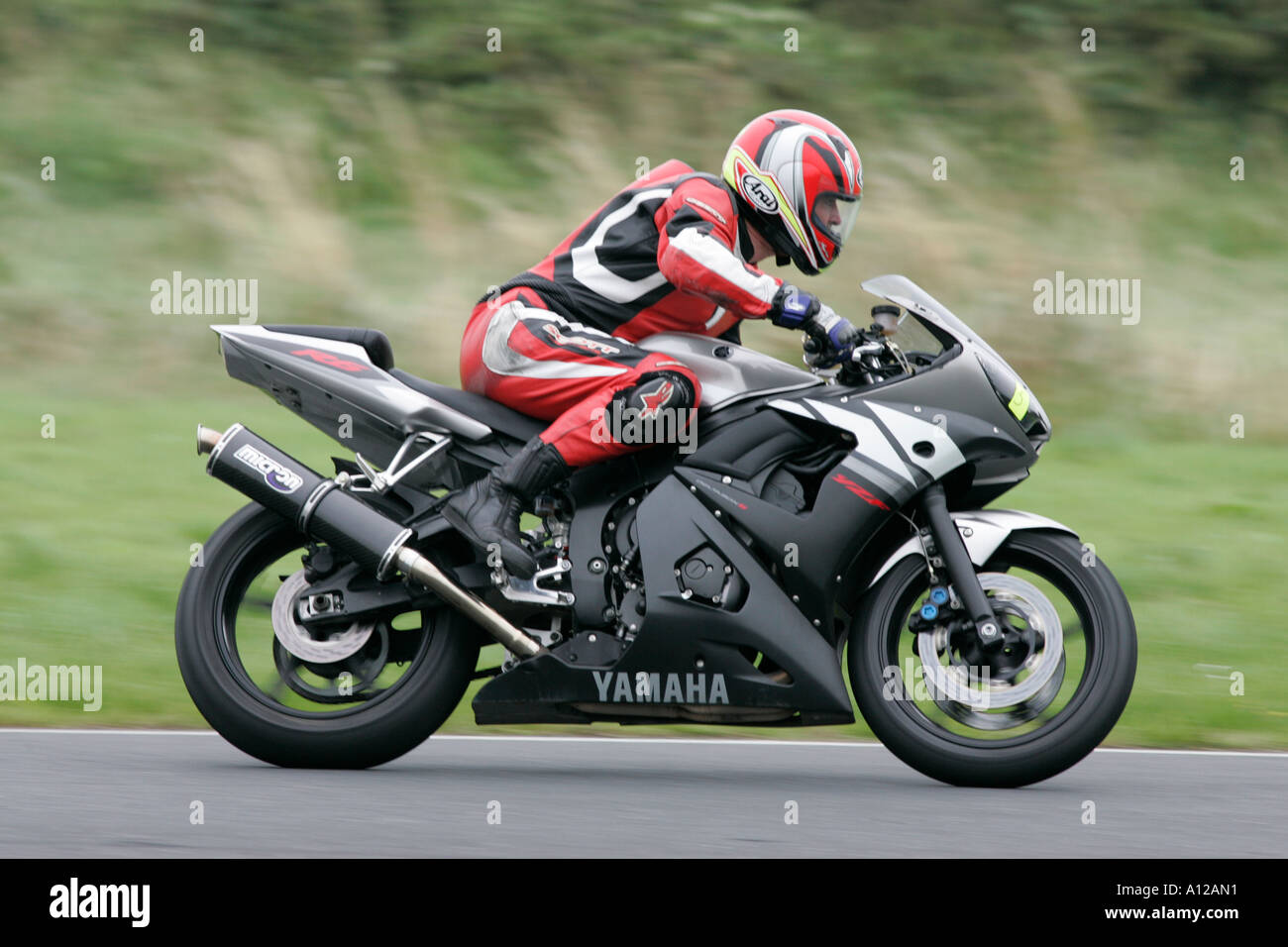 side on view of rider on black and silver yamaha R6 YZF at kirkistown ...