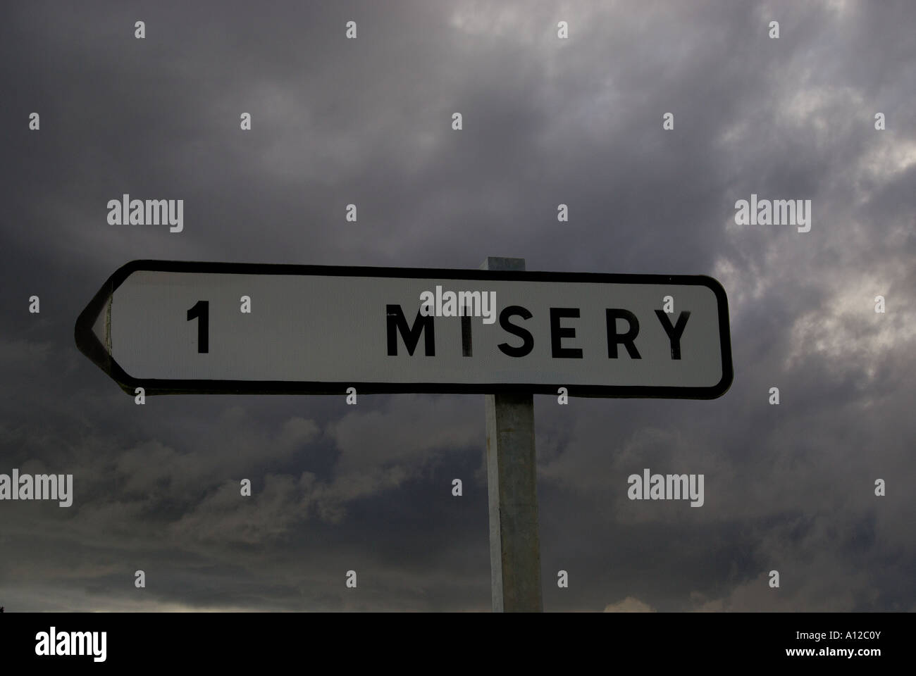 "Misery sign, stormy sky Stock Photo - Alamy