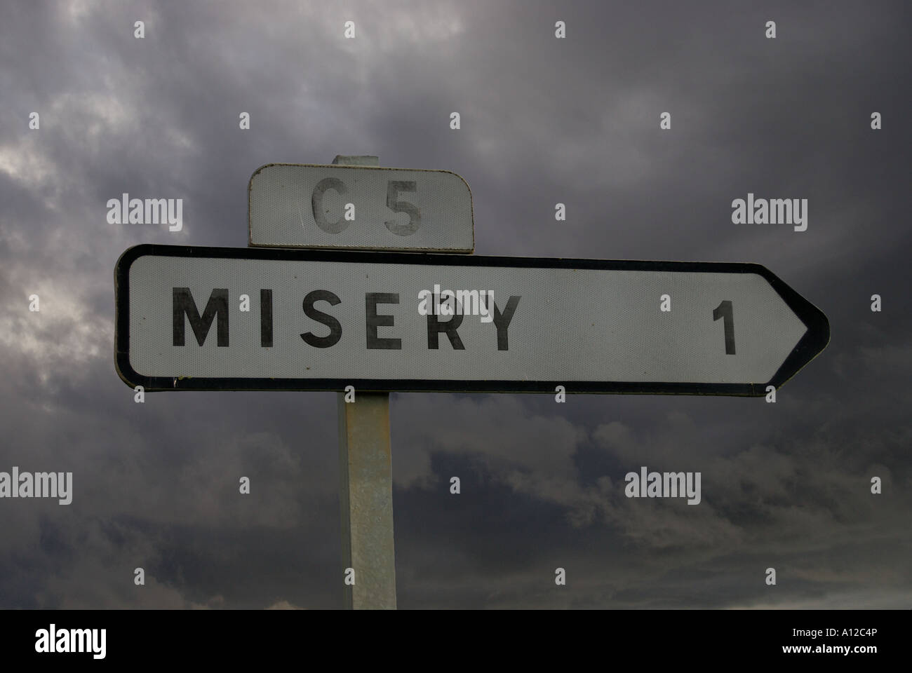 "Misery sign, stormy sky Stock Photo - Alamy