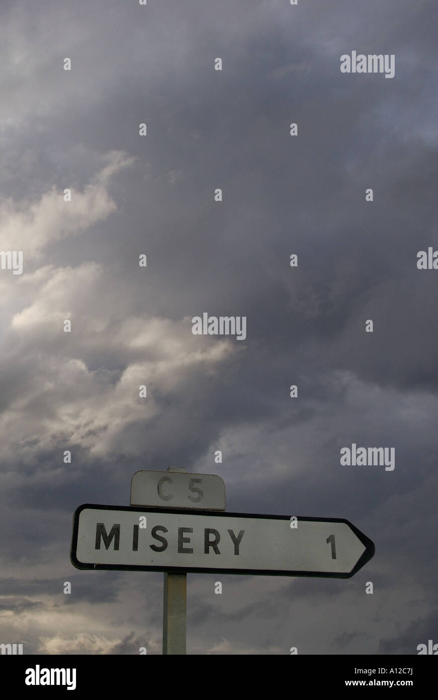 "Misery sign, stormy sky Stock Photo - Alamy