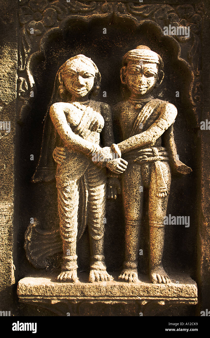 Sculpture of Indian couple holding hands on temple walls, India Stock ...