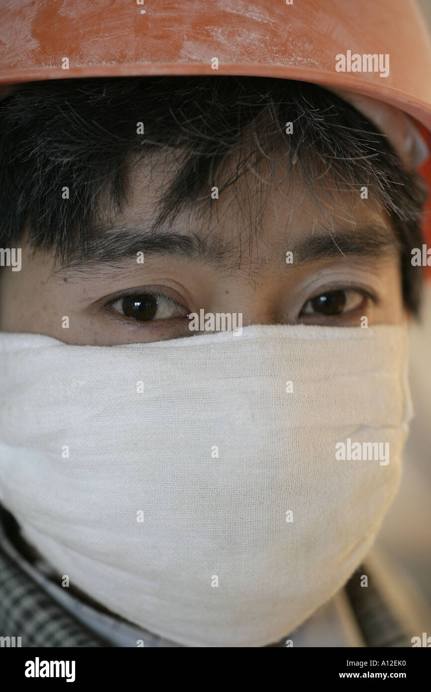 Chinese worker wearing hard hat Stock Photo - Alamy