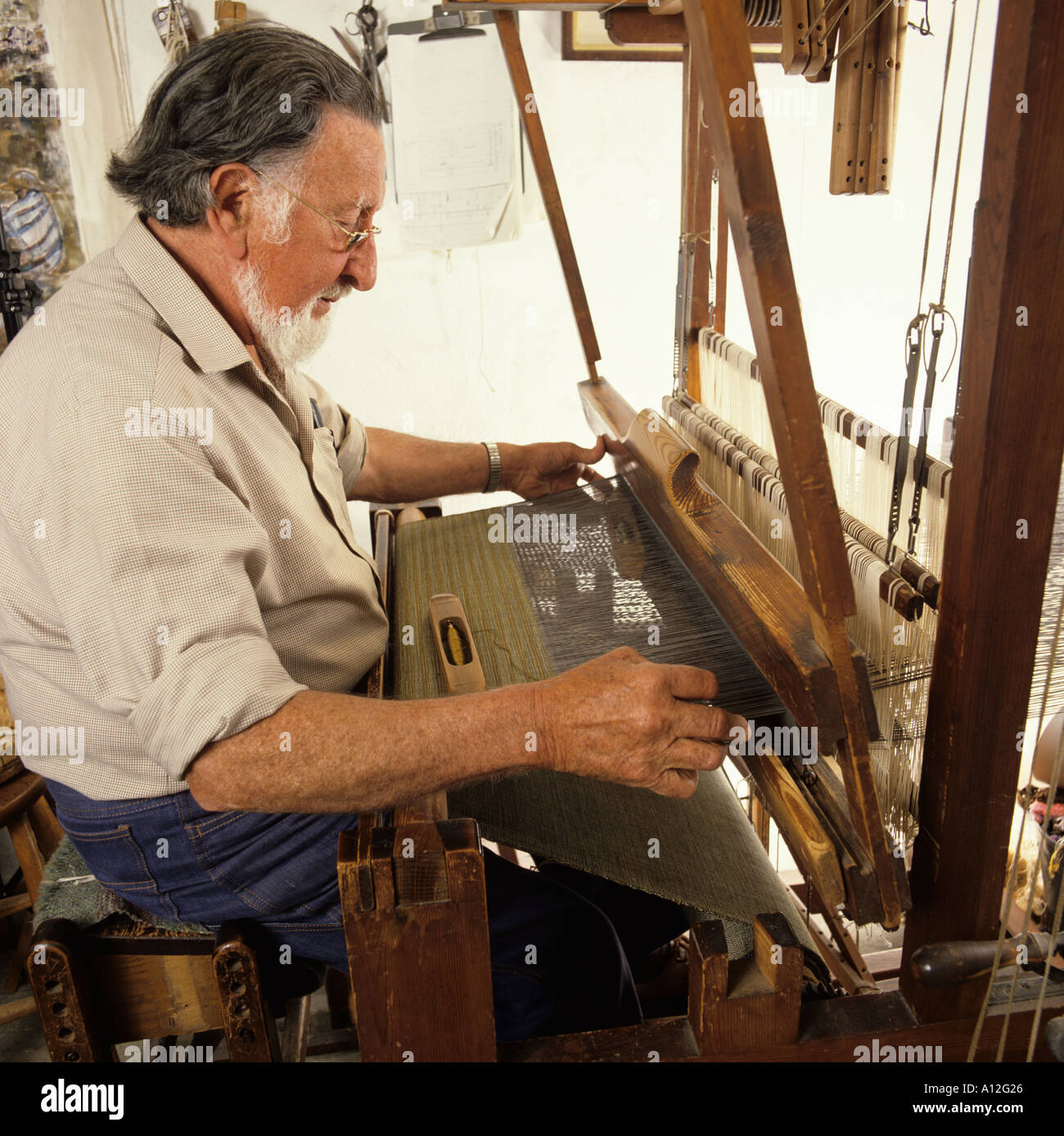 A weaver and his loom Stock Photo - Alamy