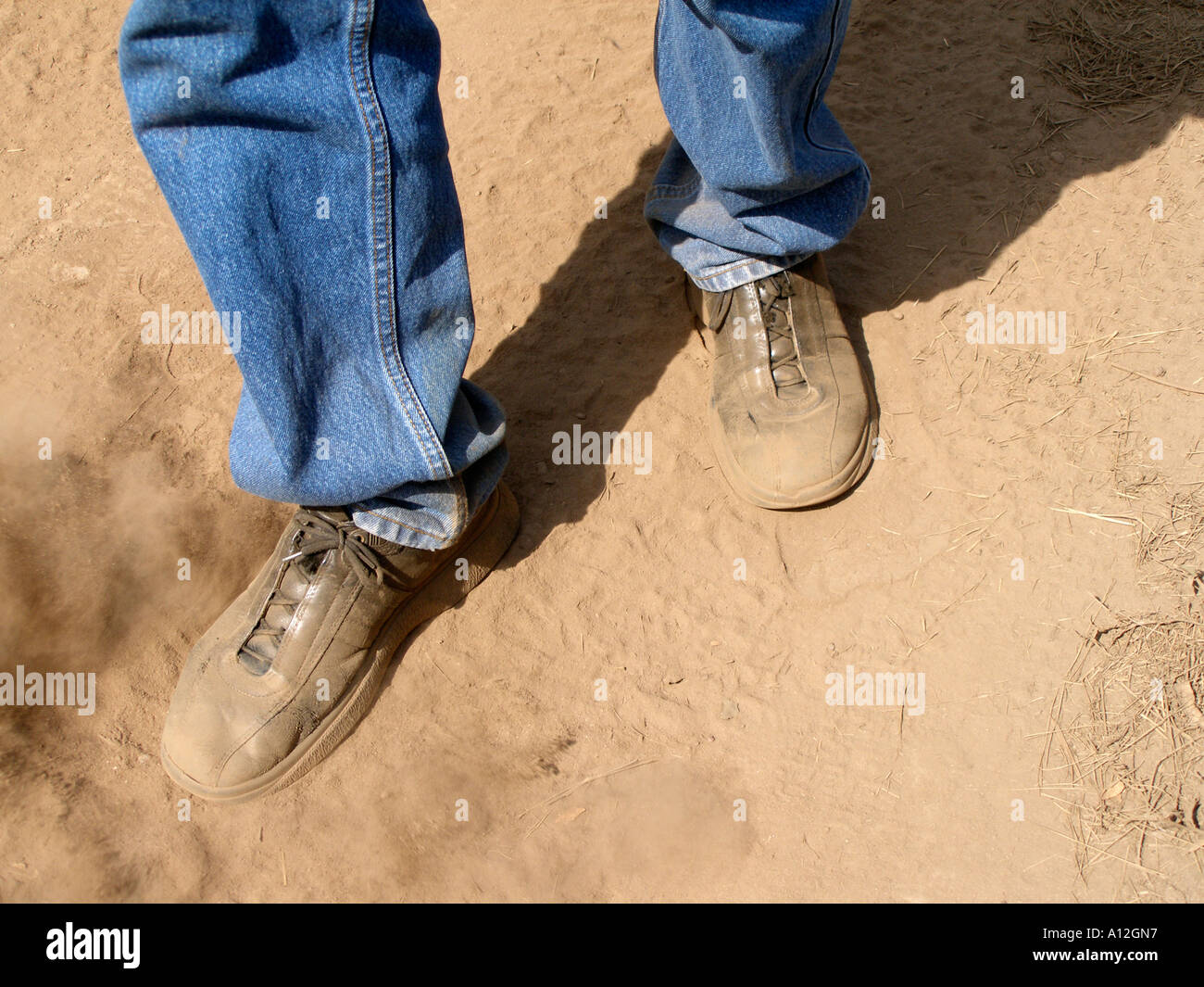 Walking on a dusty path Stock Photo - Alamy