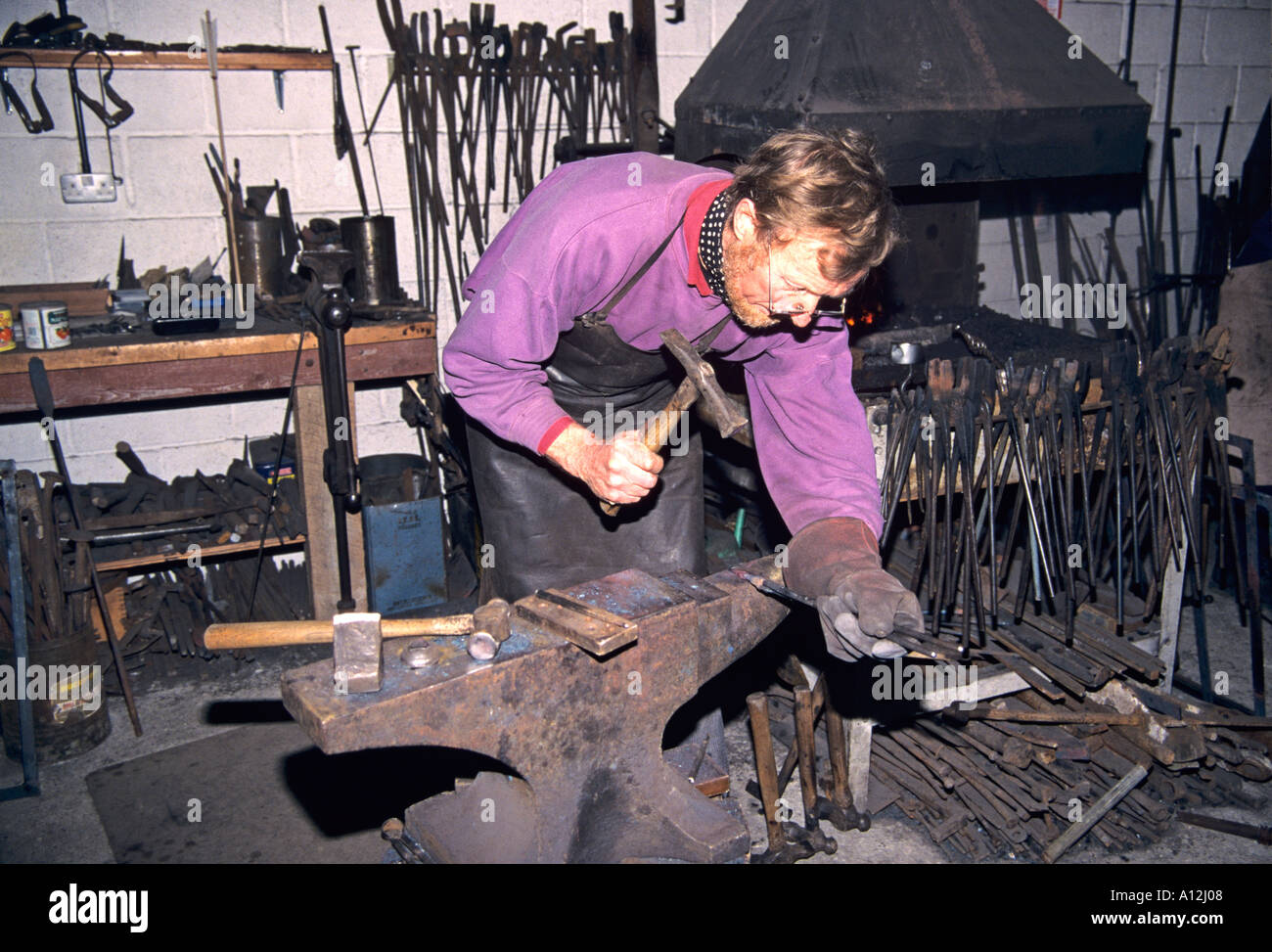Master craftsman Hector Cole making medieval arrowhead his Blacksmith ...