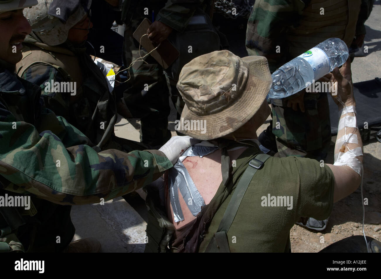 March 2003 Al Kut Iraq US Marines are wounded on the move toward Bagdad ...