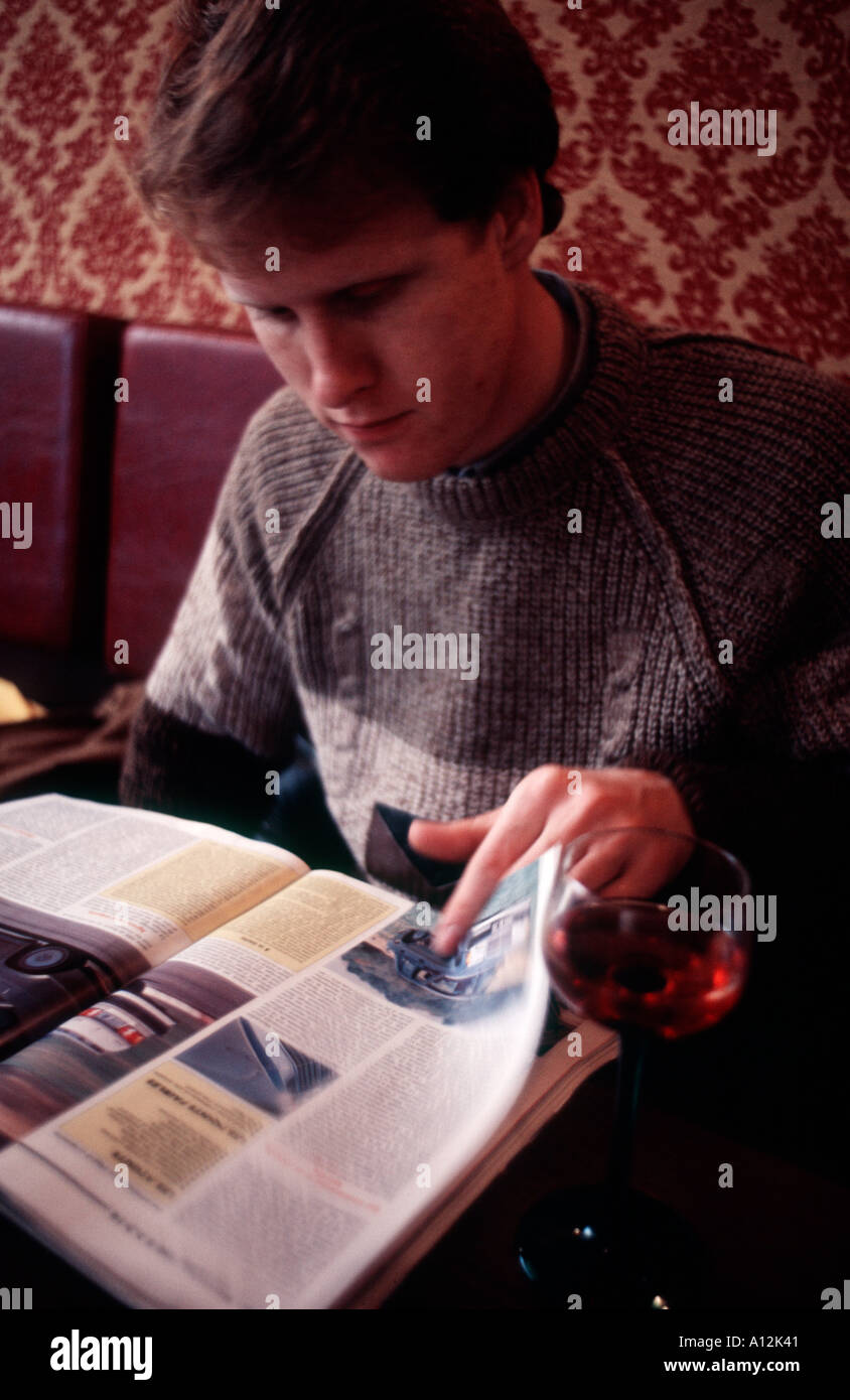 Looking at a magazine hi-res stock photography and images - Alamy
