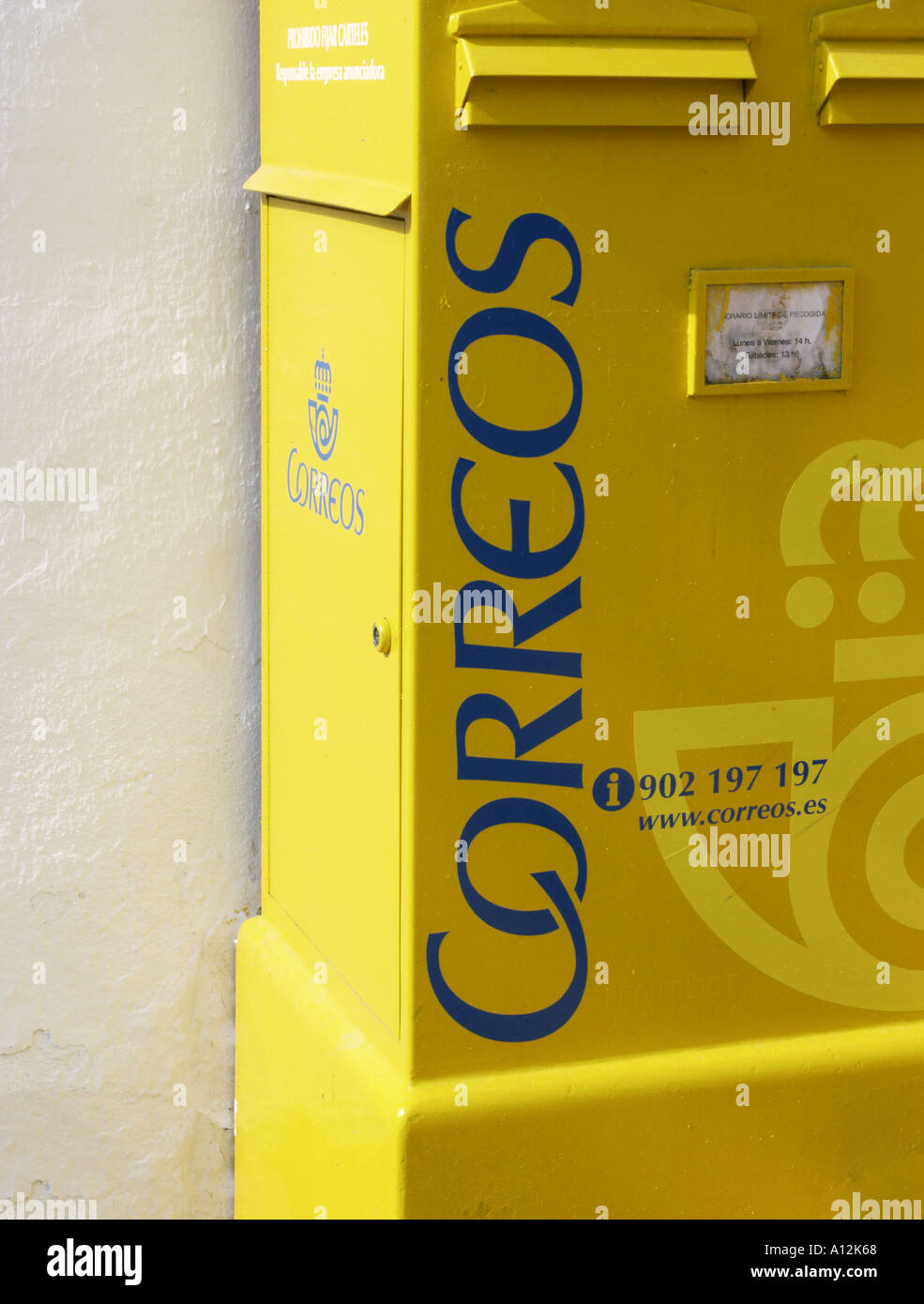 The vivid yellow of the postboxes for Correos the Spanish postal ...