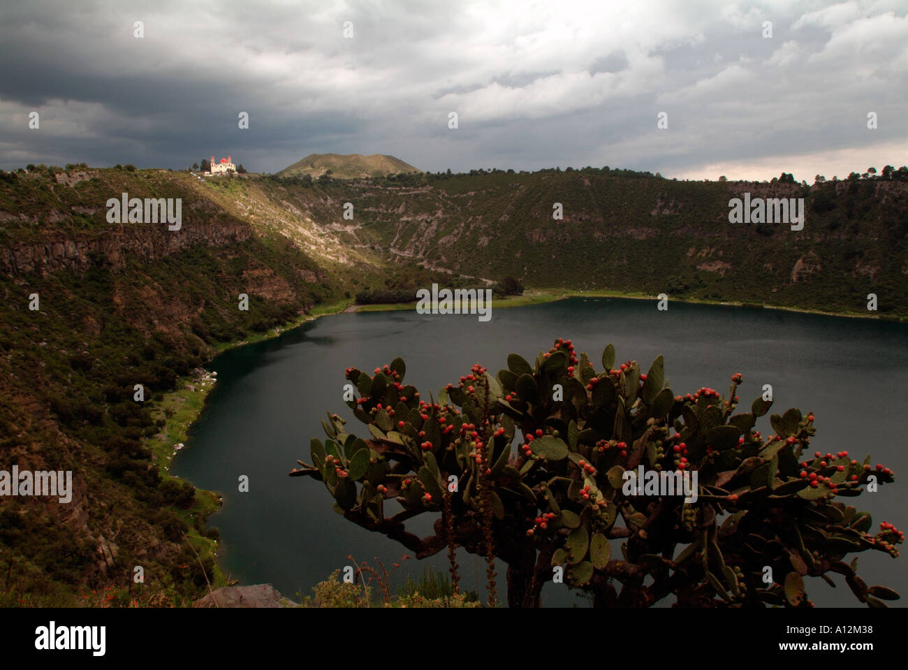 Mexican church illuminated by a shaft of light beside an extinct ...