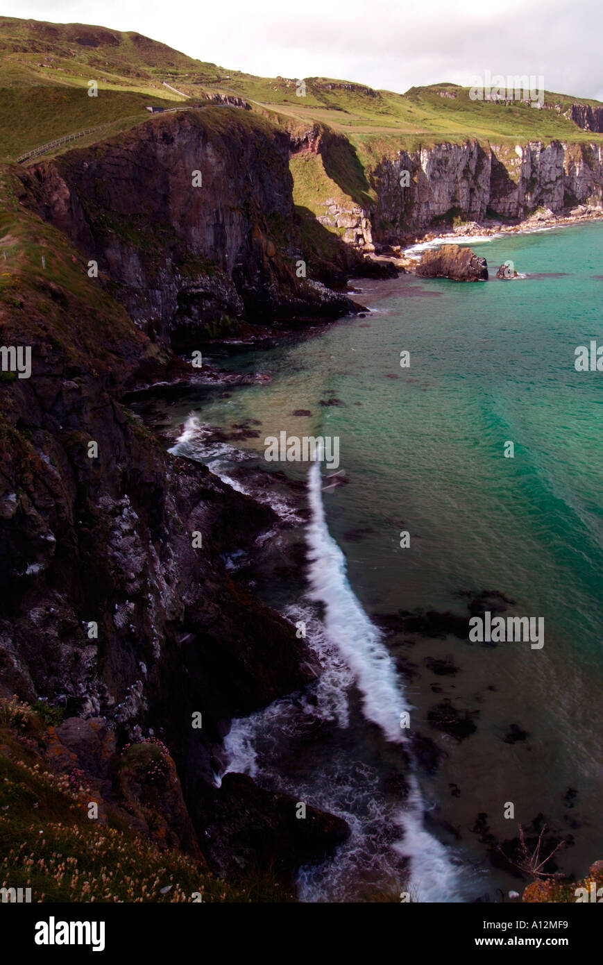 White chalk cliffs and green sea Coastal scenery near Carrick a rede ...