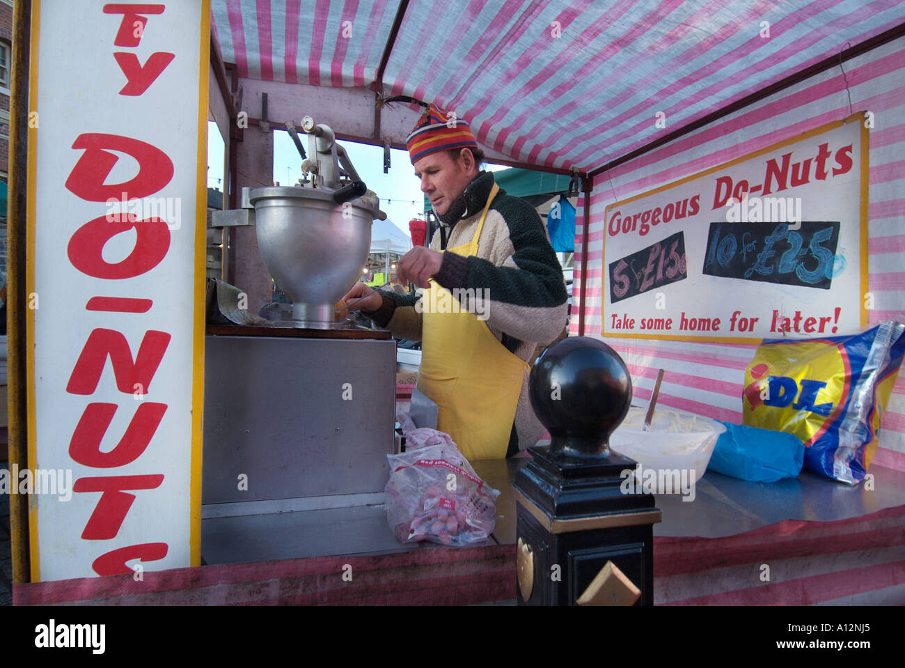 Man making selling donuts do nut stockport outdoor market England UK ...