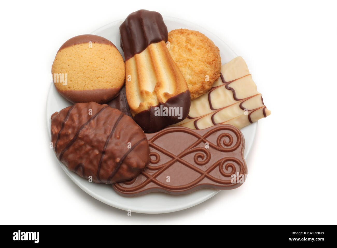 selection of biscuits coated and plain on white porcelain china ceramic ...