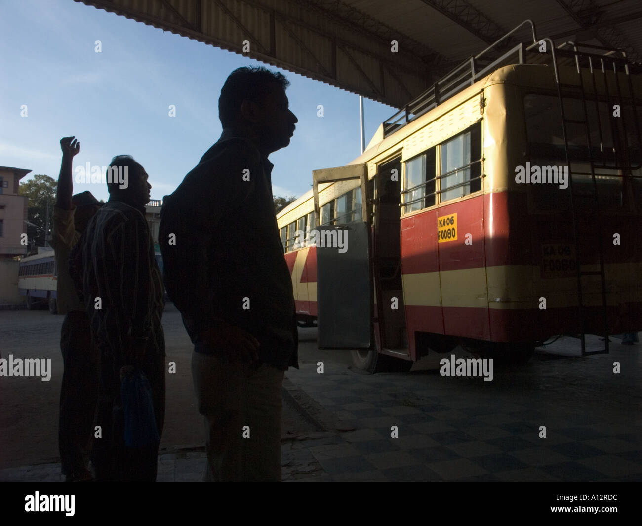 Passengers in a bus station Stock Photo - Alamy