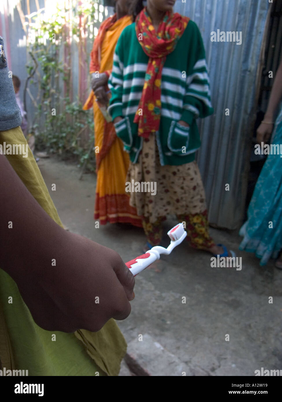 Waiting to use a communal toilet bath to brush teeth Stock Photo - Alamy