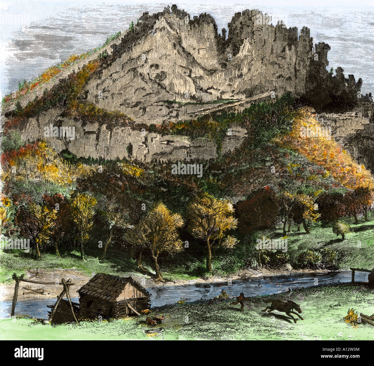 Pioneer log cabin below cliffs of the Appalachian Mountains in West ...