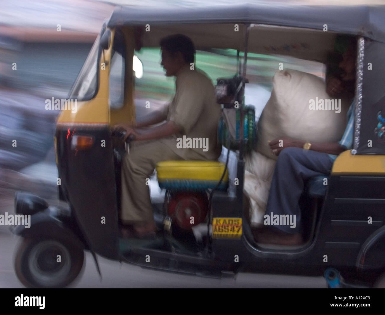 Three wheeled motorized auto rickshaws taxis at work Stock Photo - Alamy