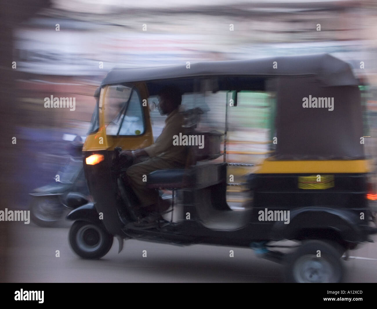 Three wheeled motorized auto rickshaws taxis at work Stock Photo - Alamy