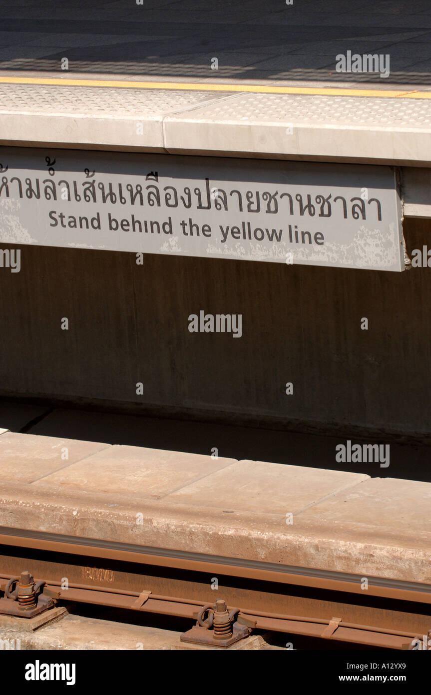 Warning sign on the BTS Skytrain Bangkok Thailand Stock Photo - Alamy