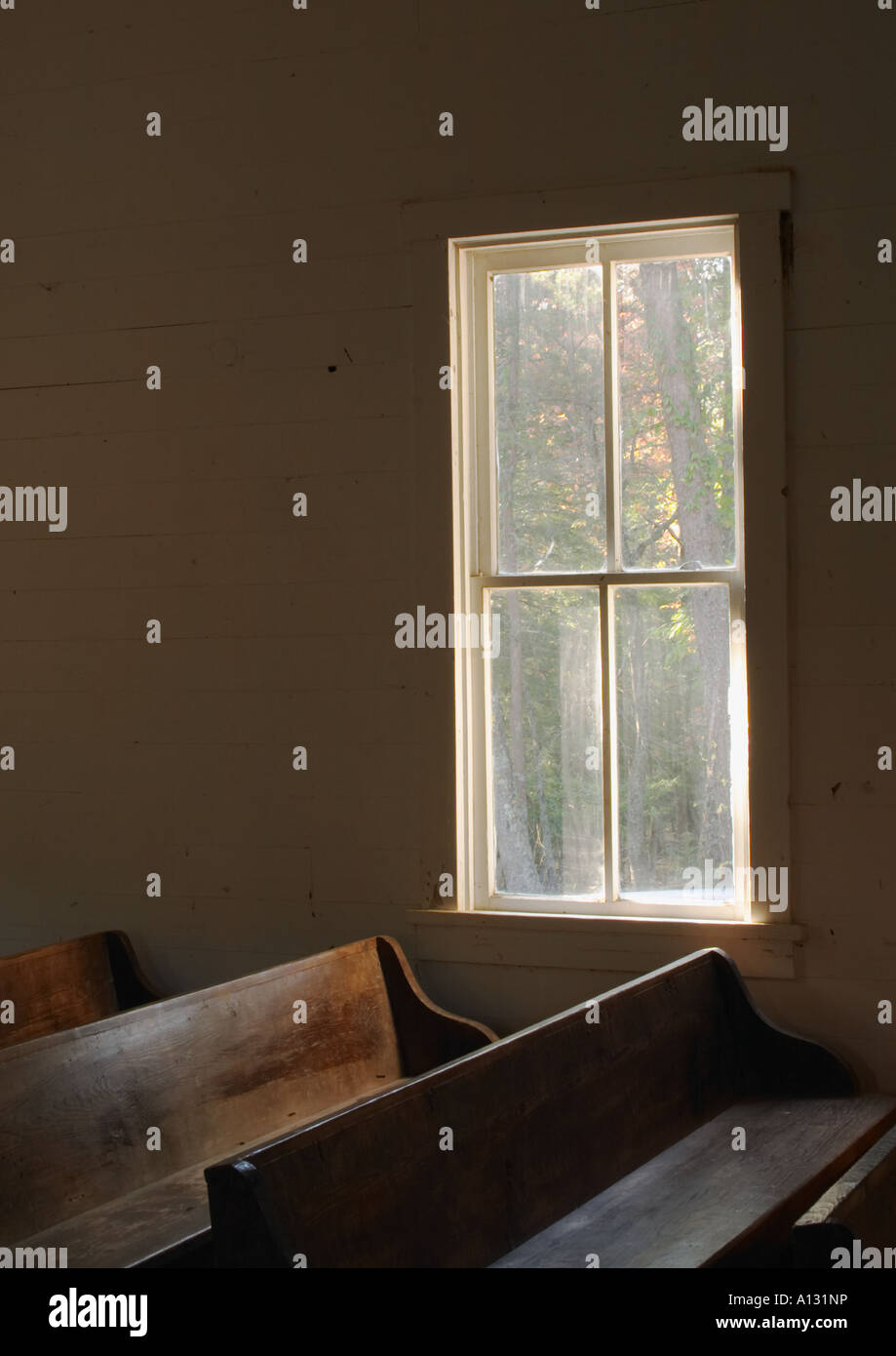 Sunlight coming thru window onto old church pews Stock Photo - Alamy