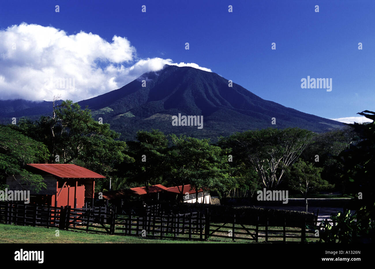Costa Rican ranch in Santa Rosa National park with Volcano in distance ...