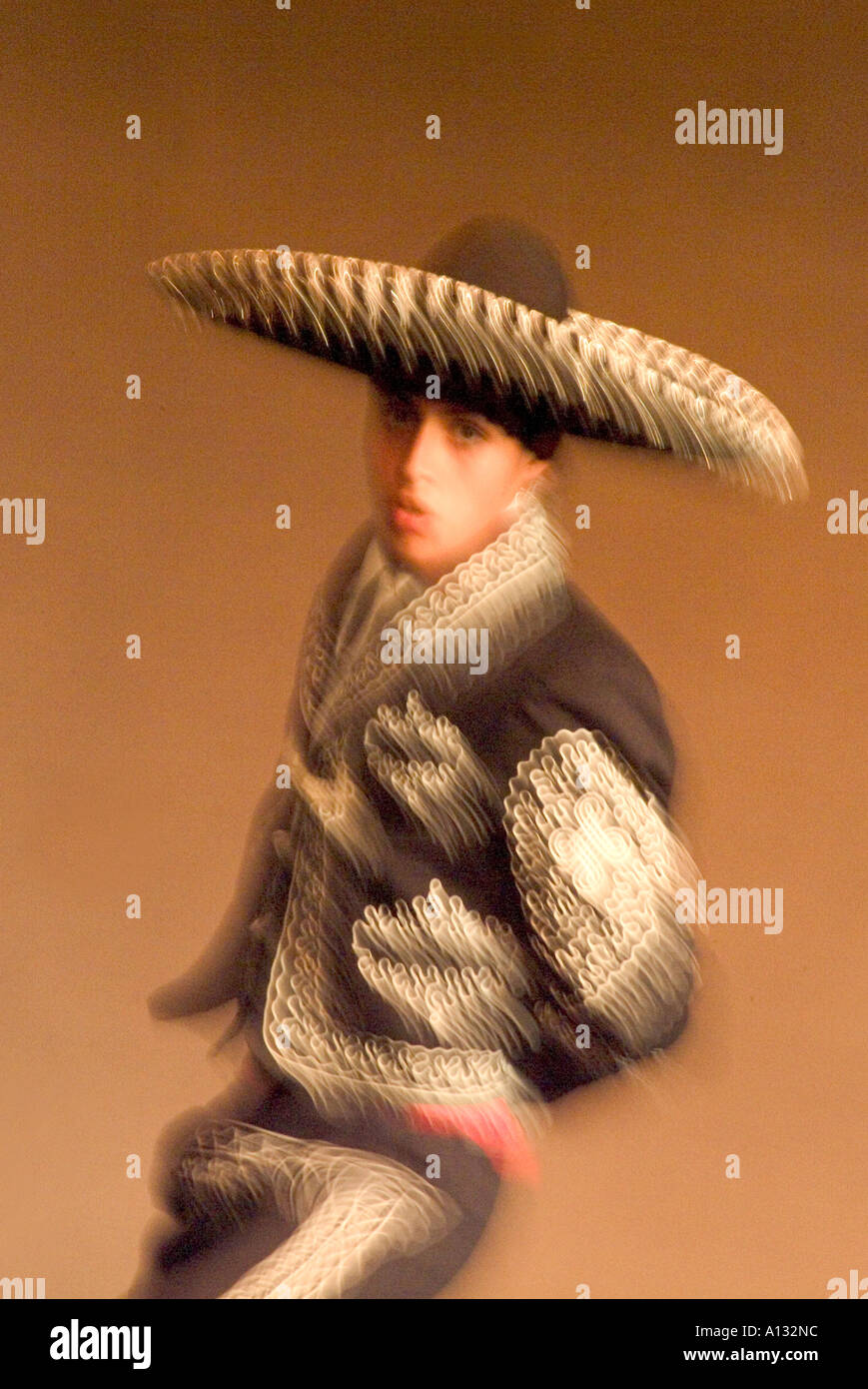 Mexican dancer in motion wearing traditional costume and sombrero Stock ...