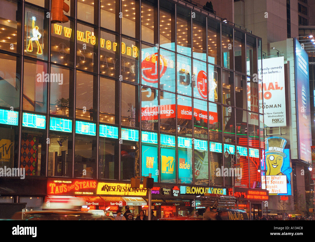 Neon signs buildings times square hi-res stock photography and images ...